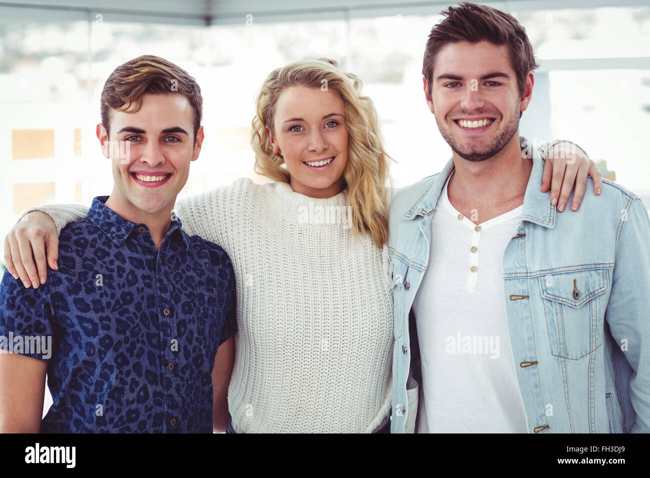 Smiling creative team working together Stock Photo - Alamy