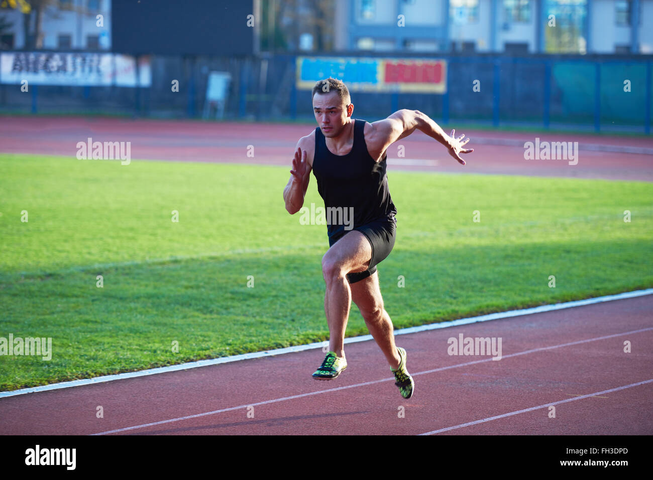 Athletic man start Stock Photo - Alamy