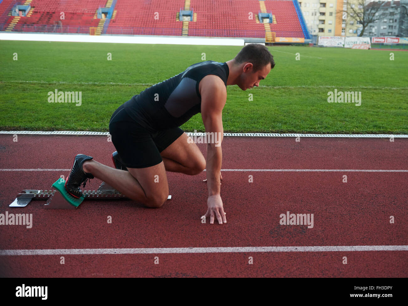 Athletic man start Stock Photo - Alamy