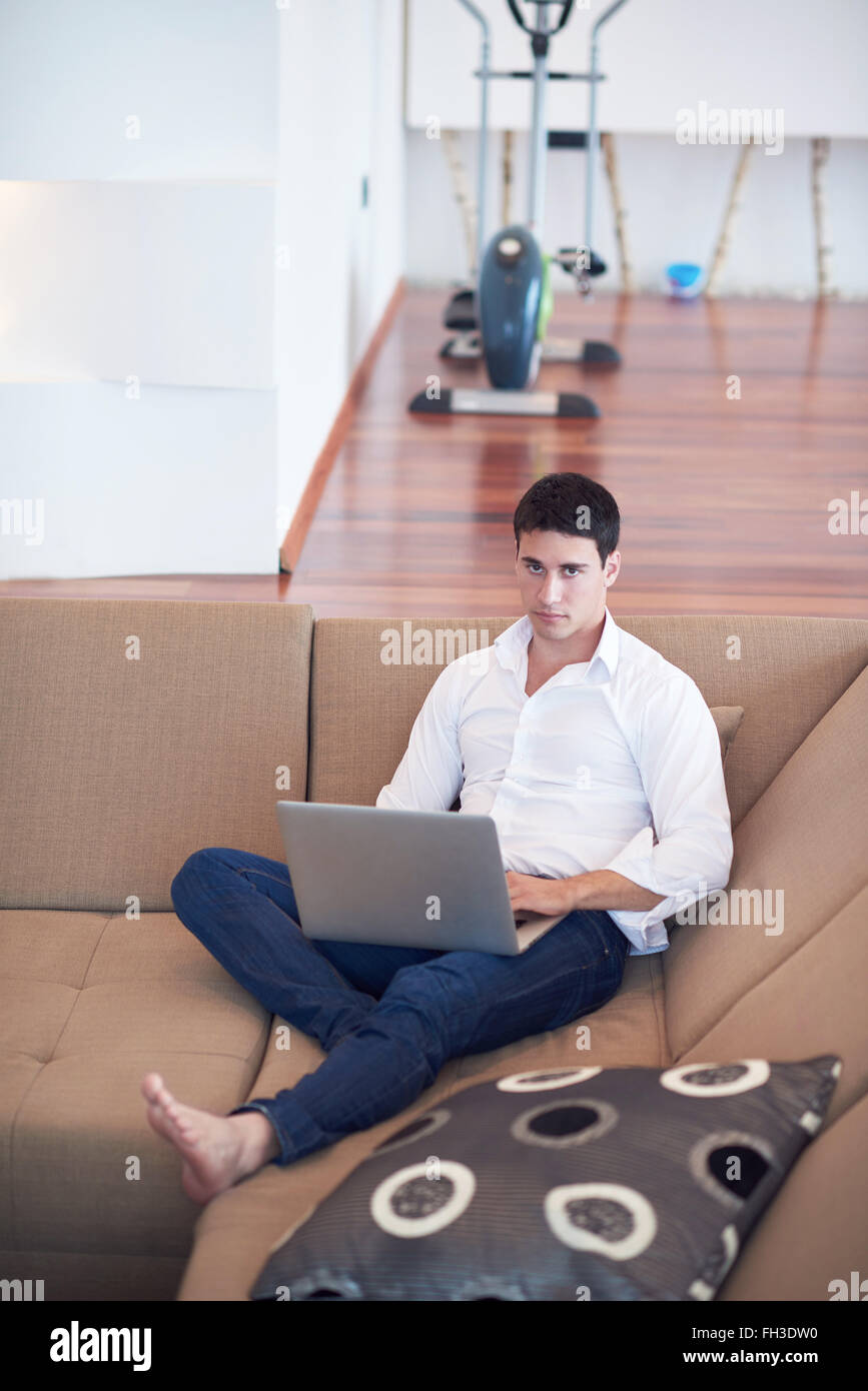 working on laptop computer from home Stock Photo - Alamy
