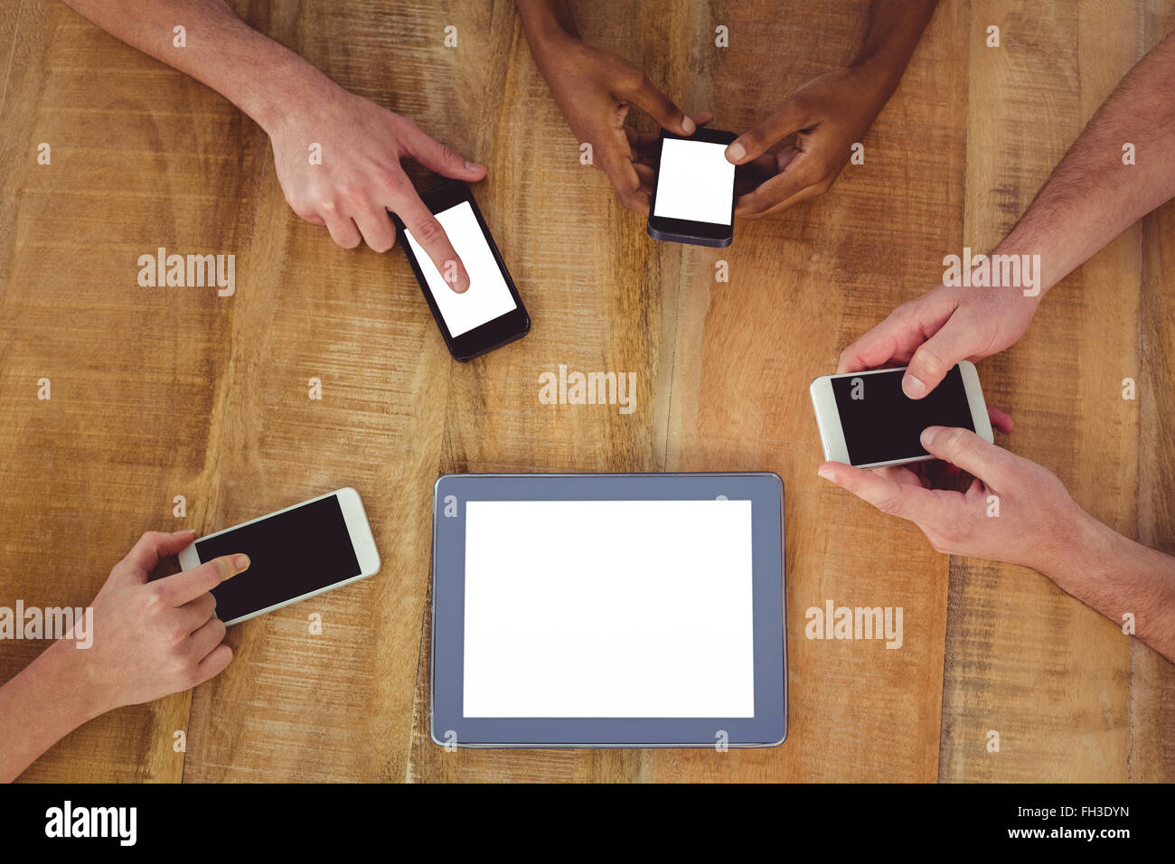 Creative team working together on a tablet and smartphones Stock Photo ...