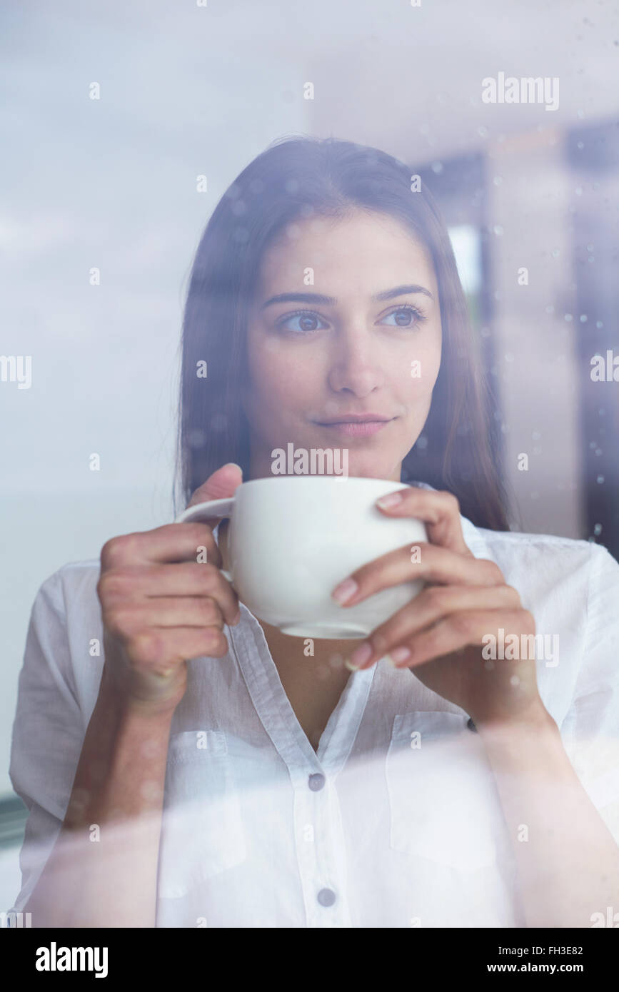 beautiful young woman drink first morning coffee Stock Photo - Alamy