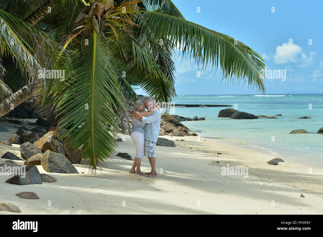 elderly couple rest at tropical resort Stock Photo - Alamy