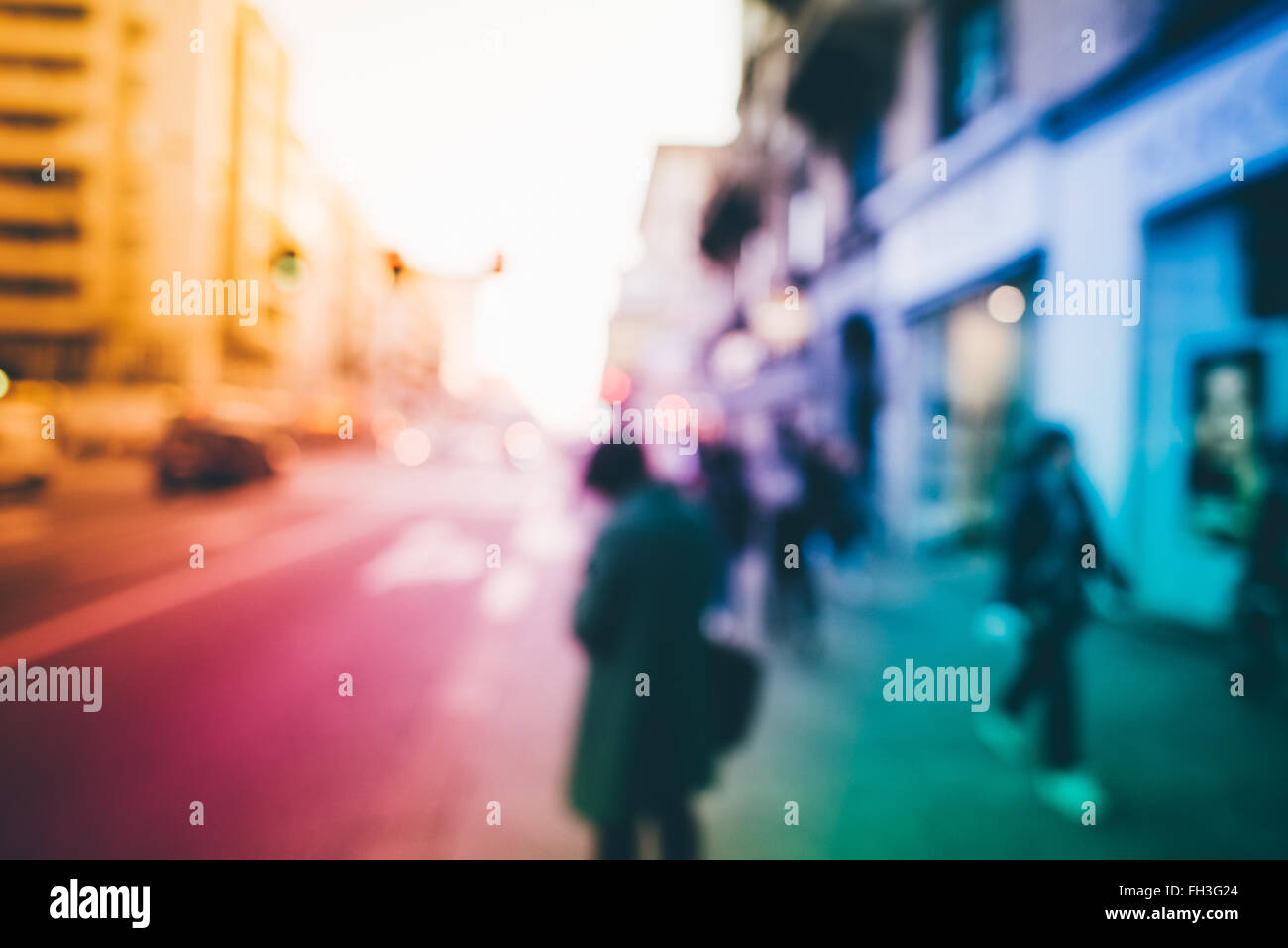 Blurred defocused colorful filtered picture of people walking outdoor ...