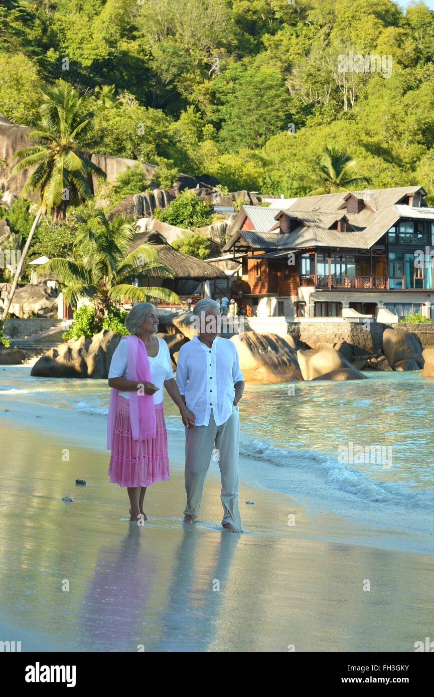 elderly couple rest at tropical resort Stock Photo - Alamy