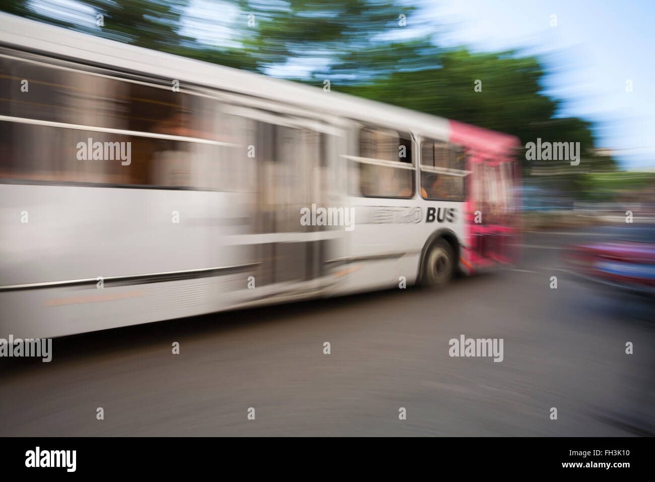 Metro bus speeding along the road at the El Malecon, Havana, Cuba, West ...