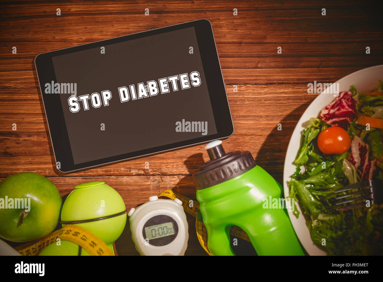 Stop diabetes against tablet on healthy persons table Stock Photo - Alamy