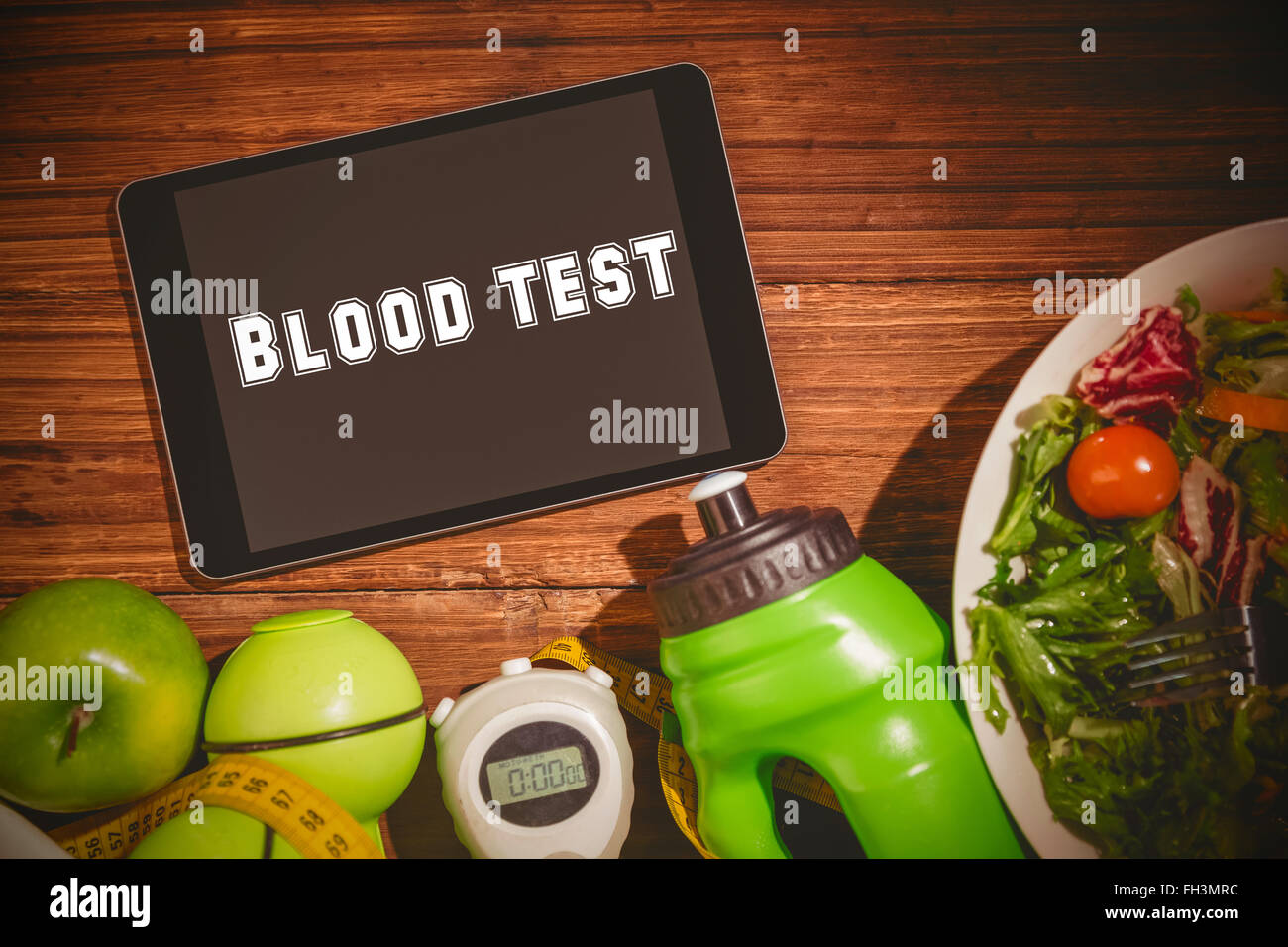 Blood test against tablet on healthy persons table Stock Photo - Alamy