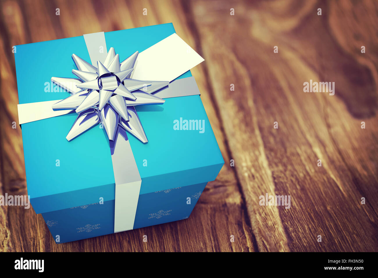 A blue Christmas gift with ribbon Stock Photo - Alamy