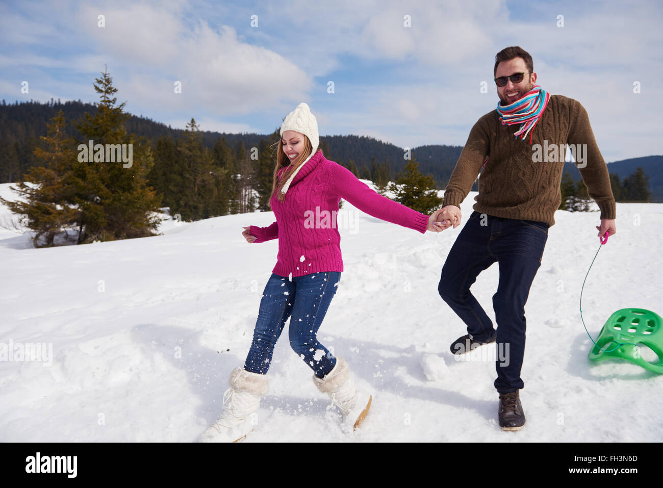 happy young couple having fun on fresh show on winter vacation Stock ...