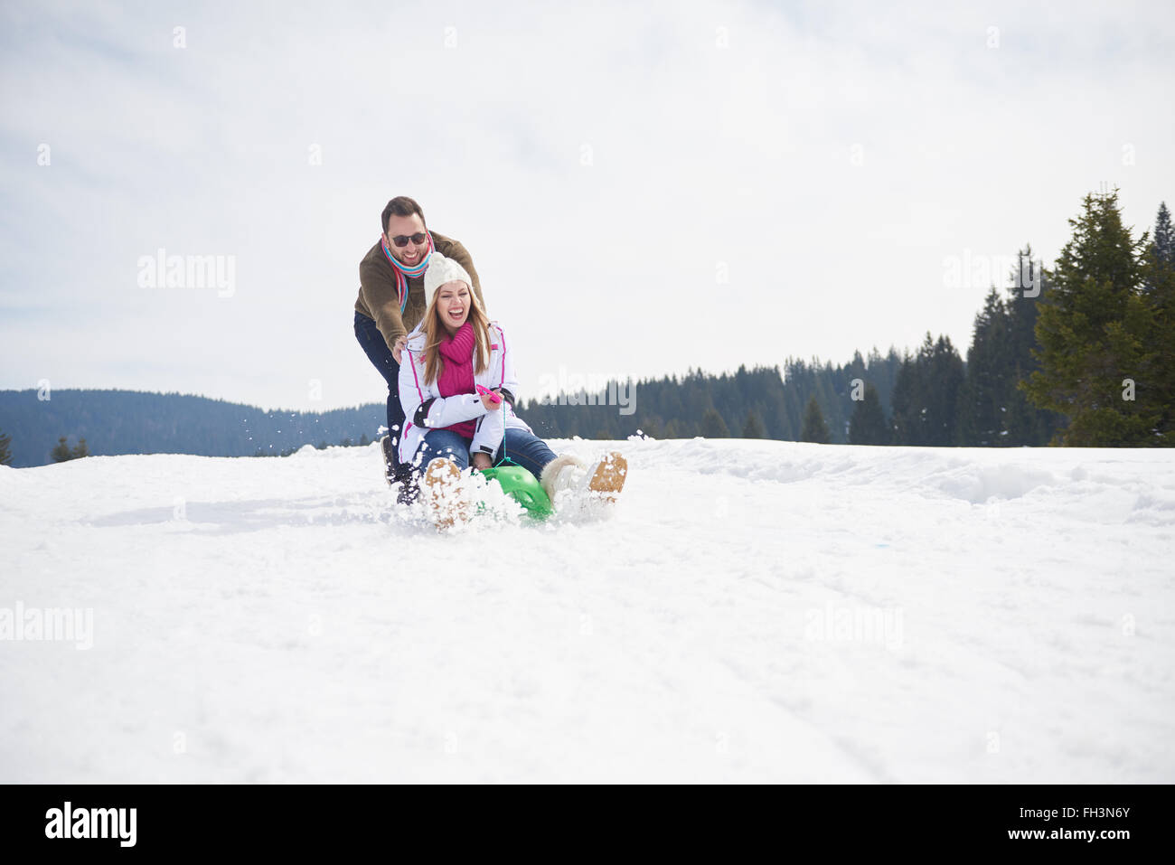 happy young couple having fun on fresh show on winter vacation Stock ...