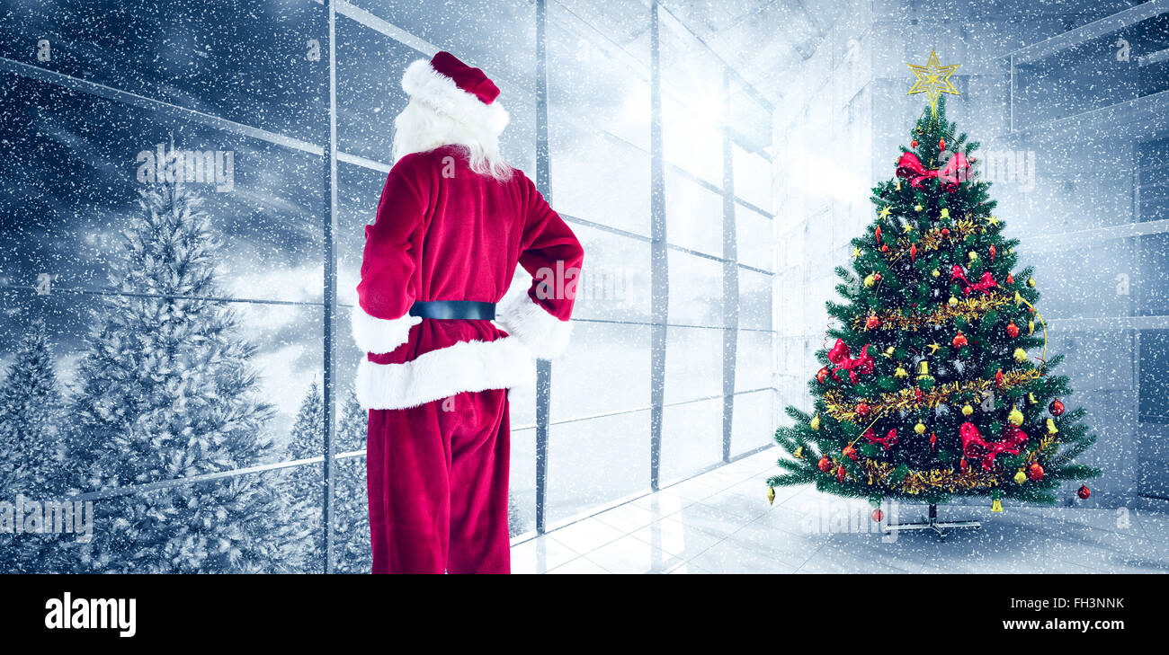 Composite image of santa looks away from the camera Stock Photo - Alamy