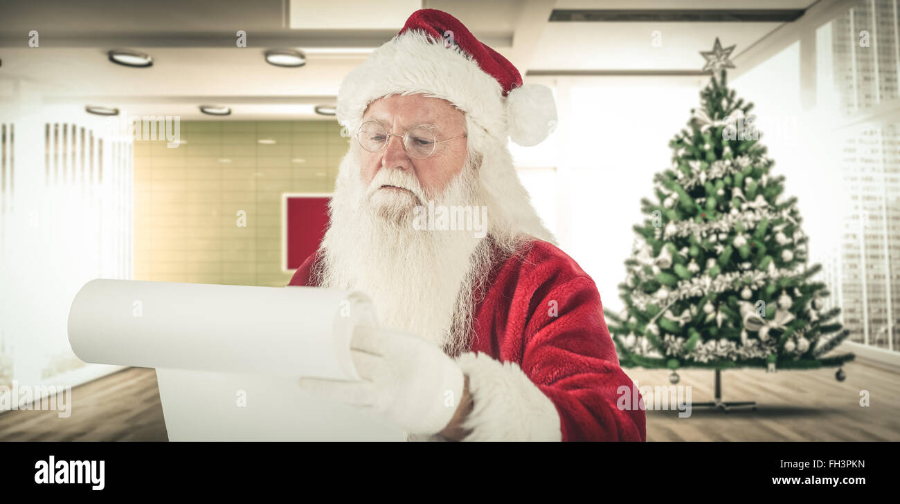 Composite image of santa claus checking his list Stock Photo - Alamy
