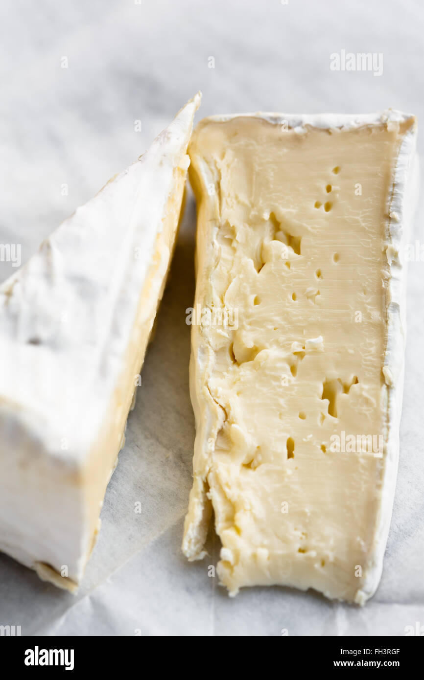 Two slices of Brie Stock Photo - Alamy