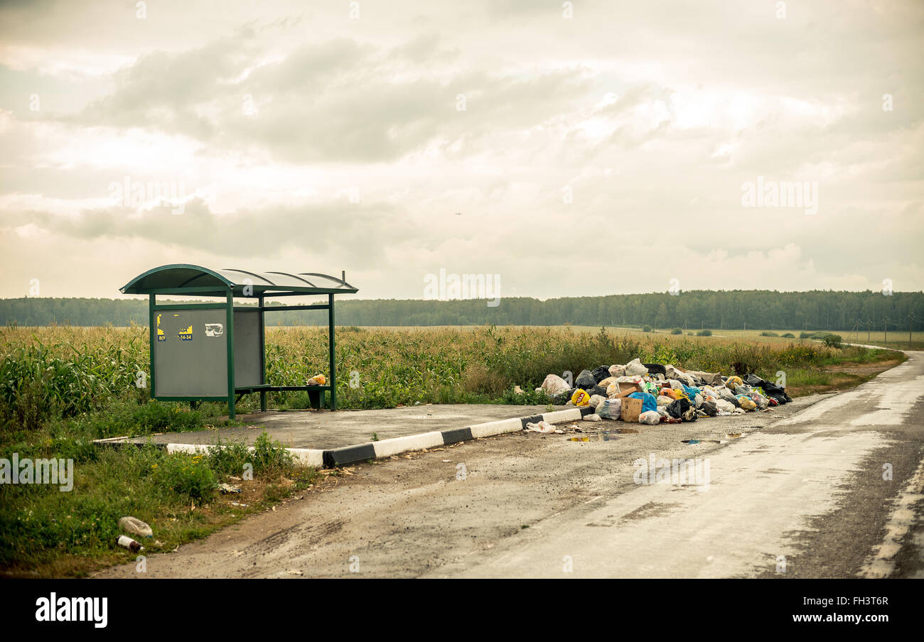Somewhere in Russia. trash dump on rural bus-stop Stock Photo - Alamy