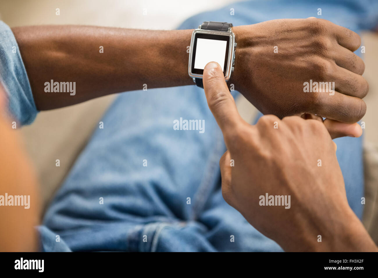 Black arm with a smart watch hi-res stock photography and images - Alamy