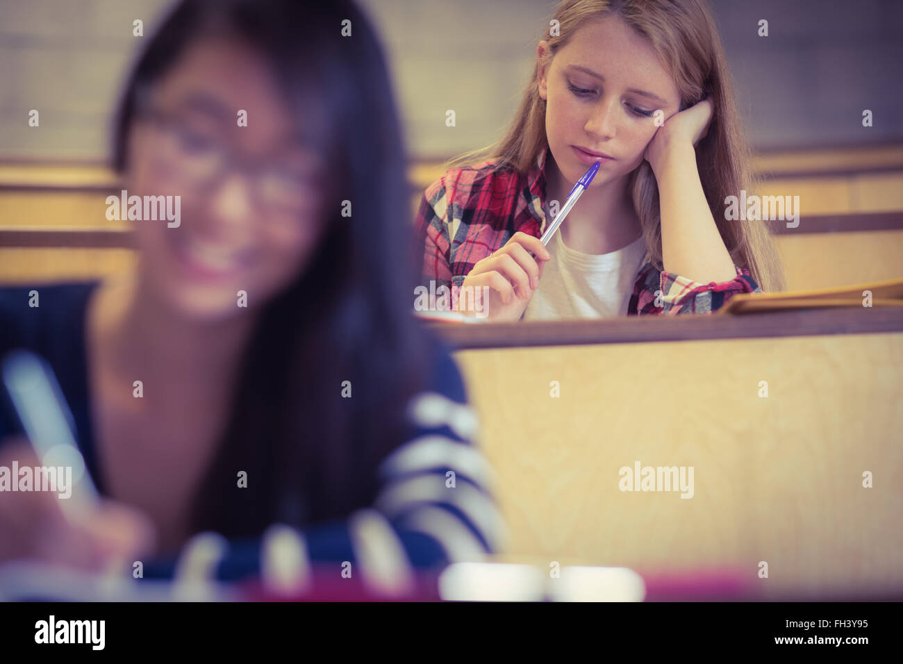 Thoughtful student during class Stock Photo - Alamy