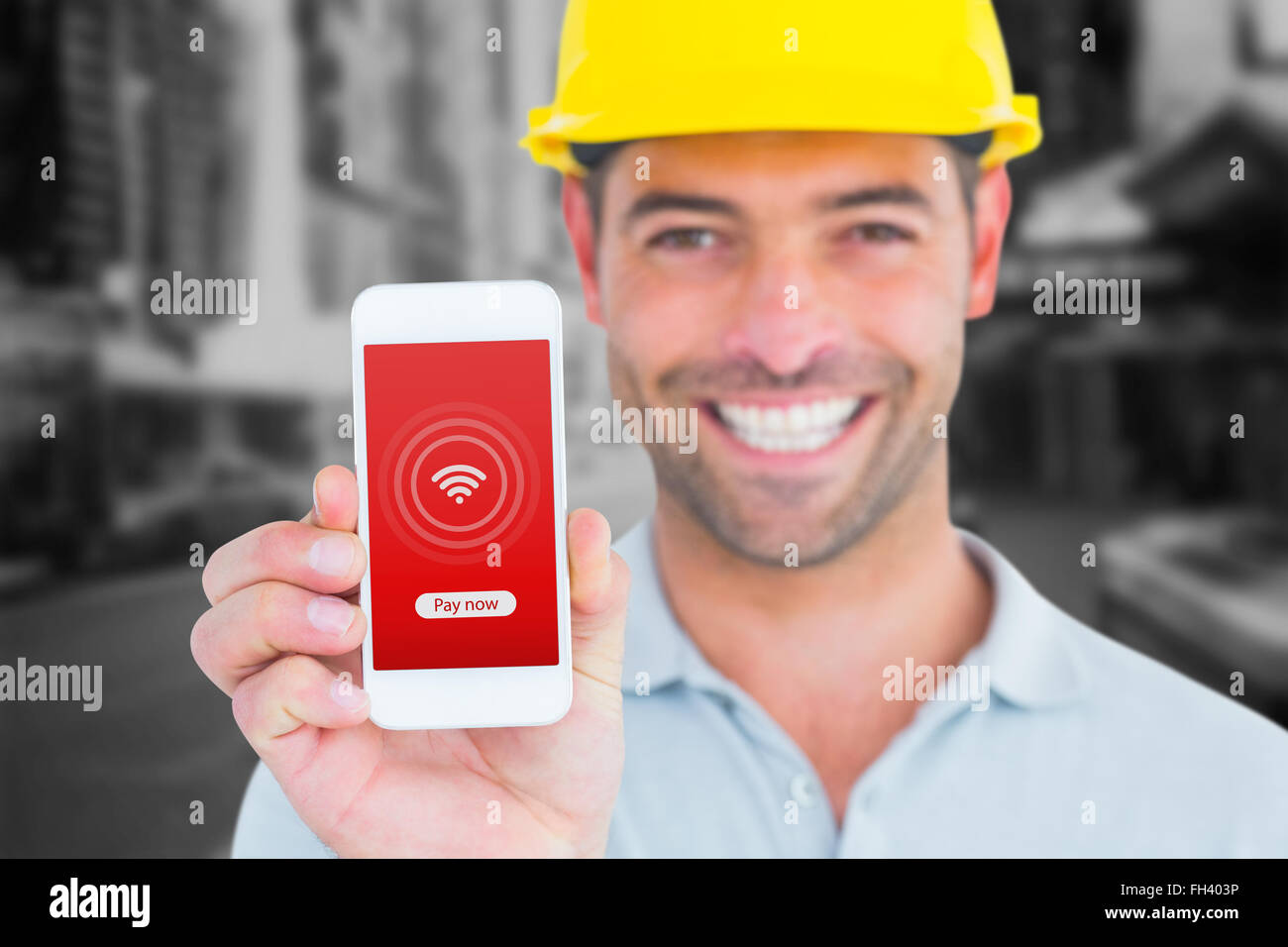 Composite image of portrait of smiling handyman showing smart phone ...