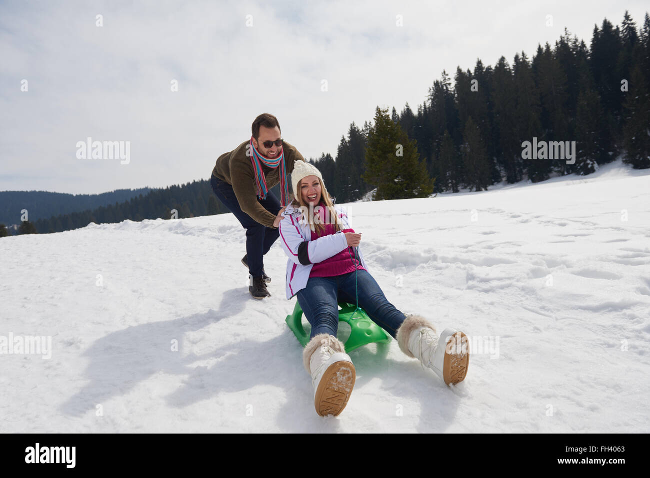 happy young couple having fun on fresh show on winter vacation Stock ...