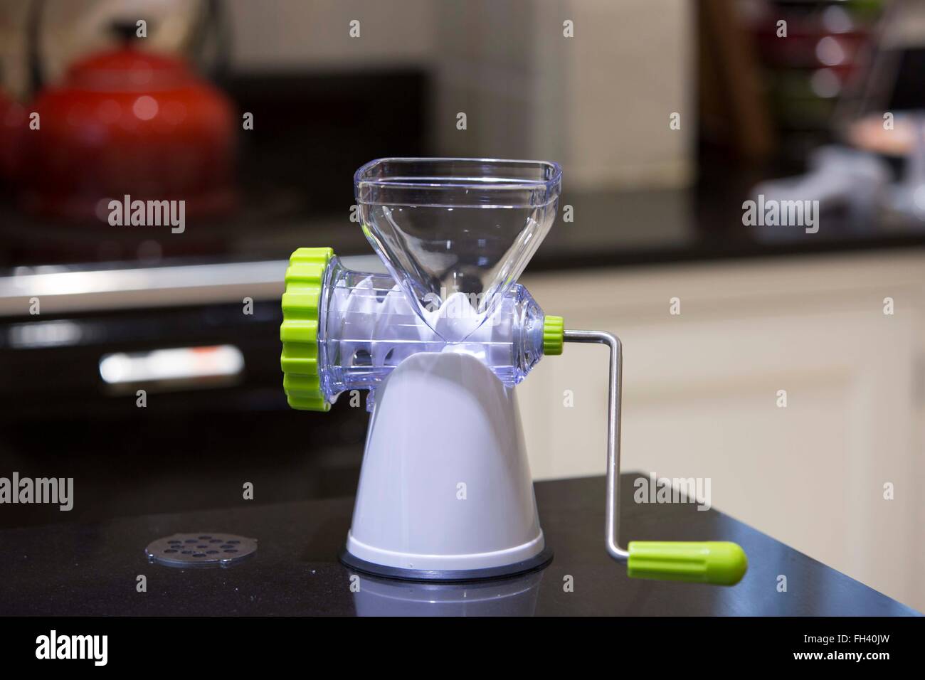 A shiny new, unused domestic kitchen gadget - a mincer also known as a ...