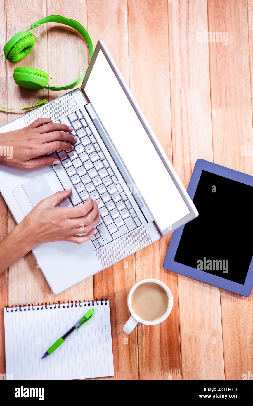 Overhead of feminine hands typing on laptop Stock Photo - Alamy