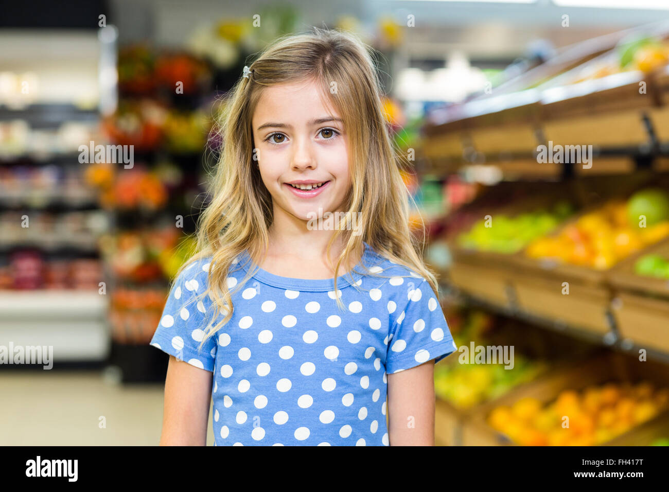 Smiling young girl looking at camera Stock Photo - Alamy