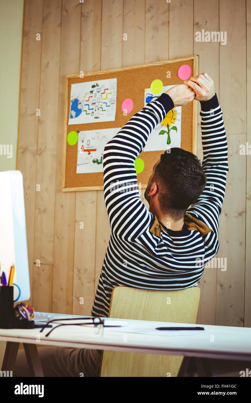 Man relaxing at his desk Stock Photo - Alamy