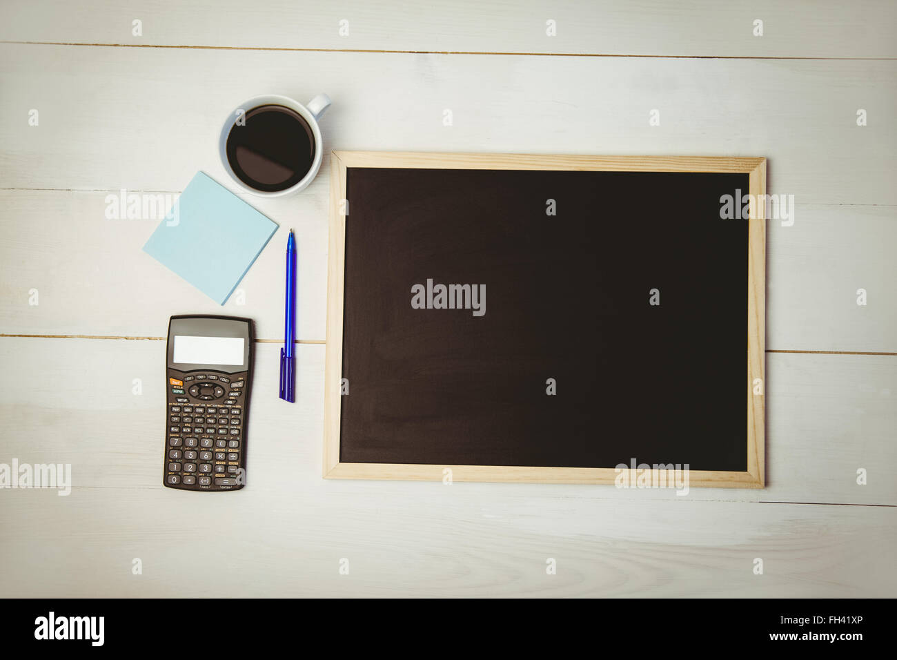 Overhead of desk with chalkboard and calculator Stock Photo - Alamy