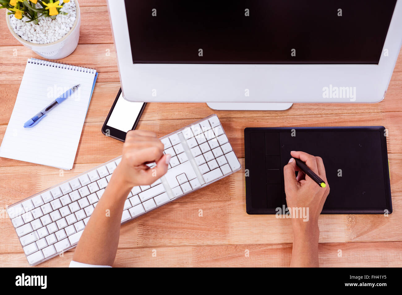 Part of hand using stylus Stock Photo - Alamy