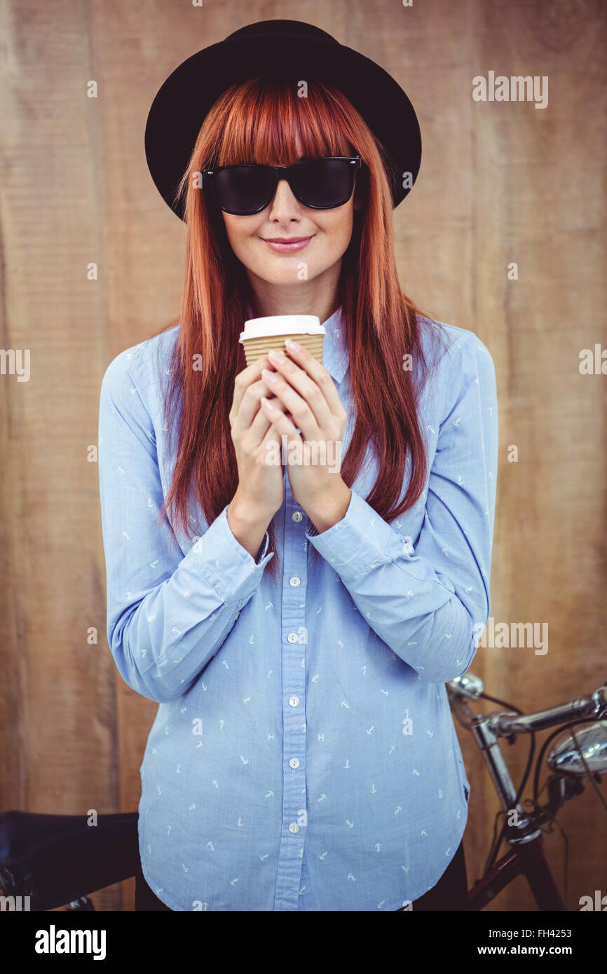Smiling hipster woman drinking coffee Stock Photo - Alamy
