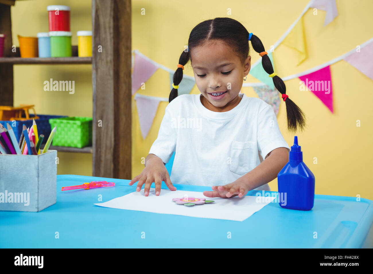 Happy girl making arts and crafts Stock Photo - Alamy