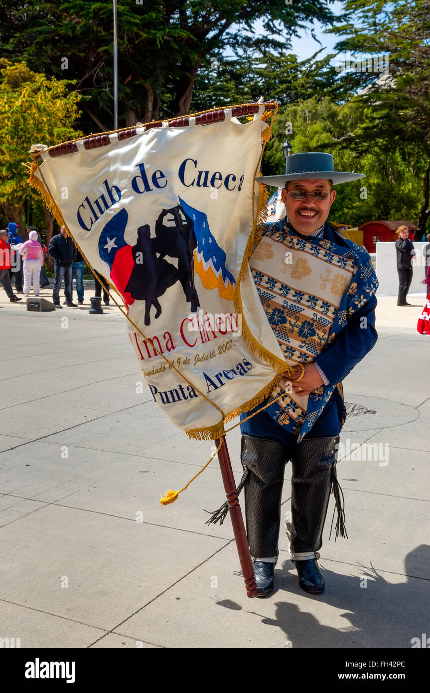 The chilean man In chilean clothing holds a banner in the hands during ...