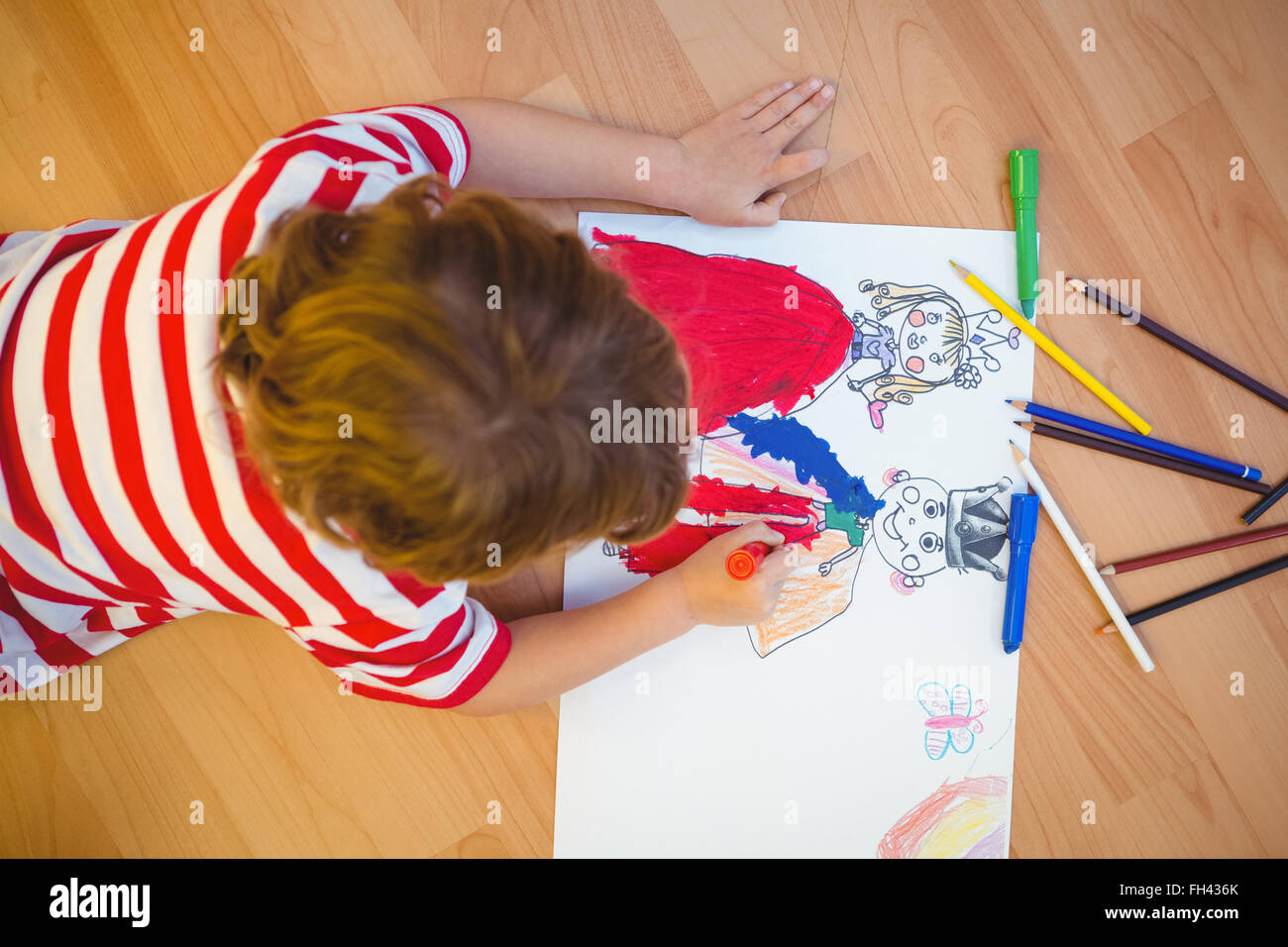 Boy lying on the ground Stock Photo - Alamy