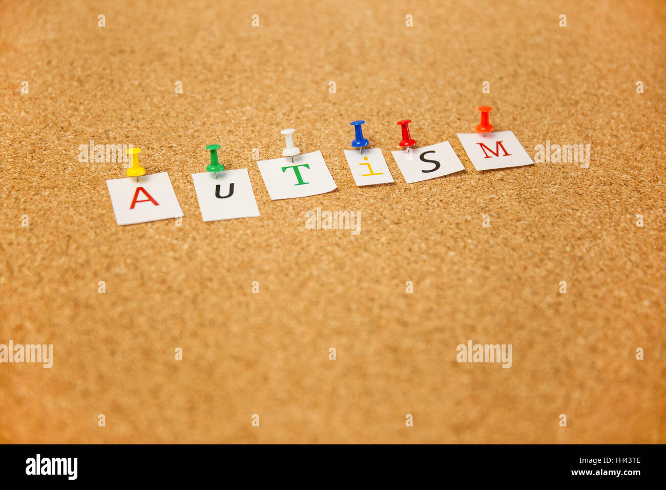 Autism stuck on cork board Stock Photo - Alamy