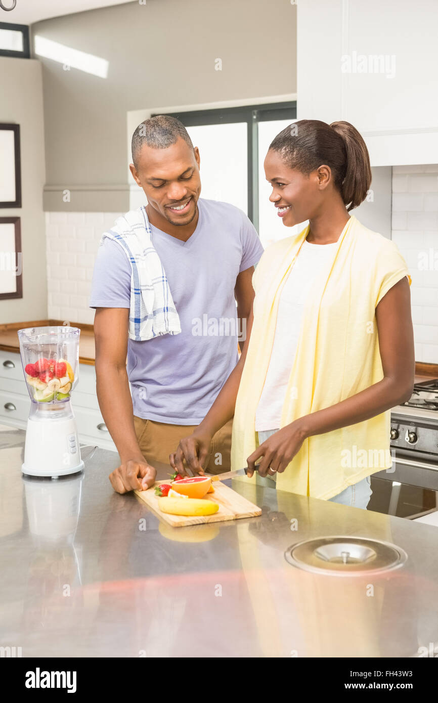 Young casual couple making fruits Stock Photo - Alamy
