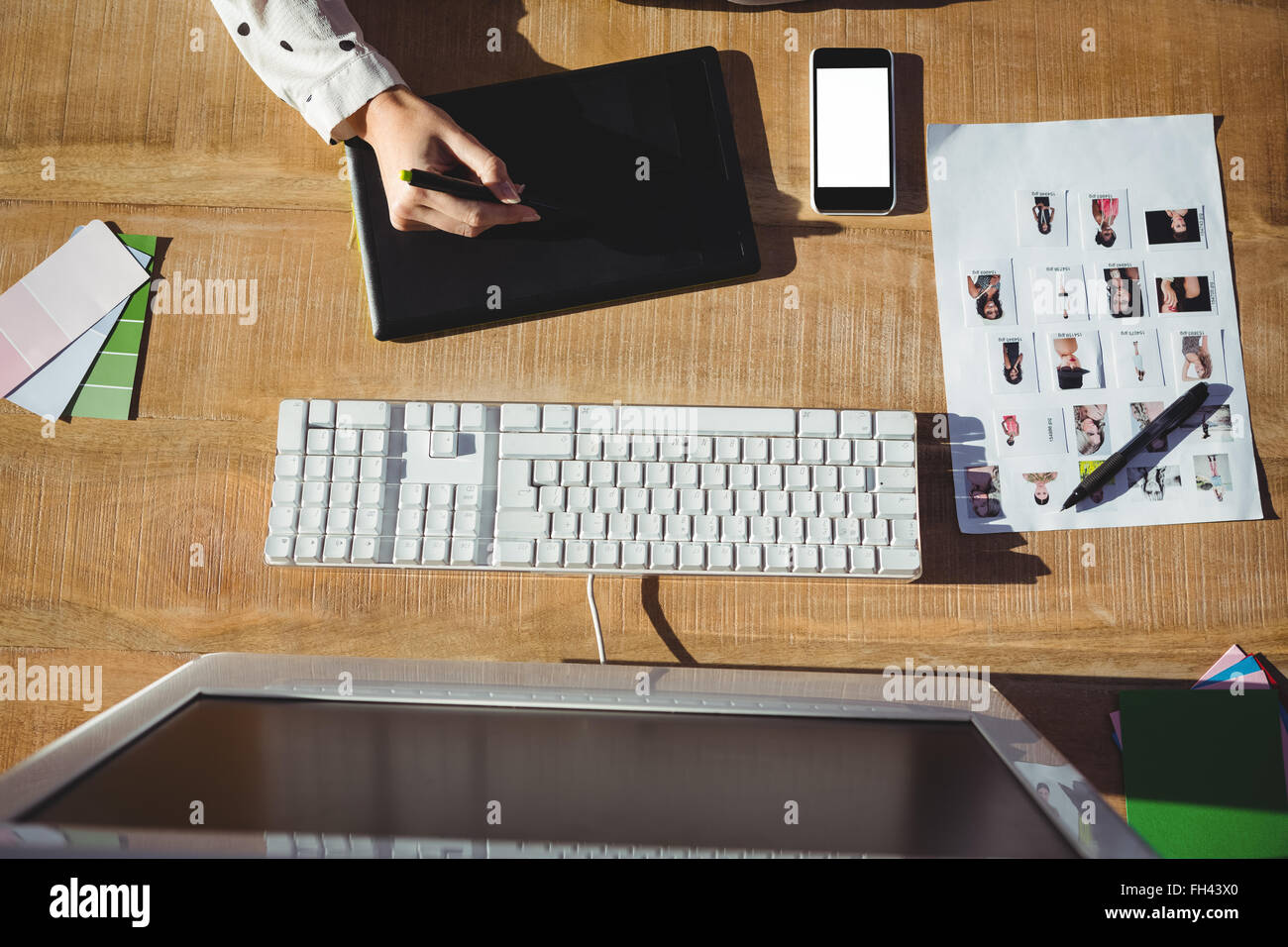 Cropped image of woman using graphics tablet Stock Photo - Alamy