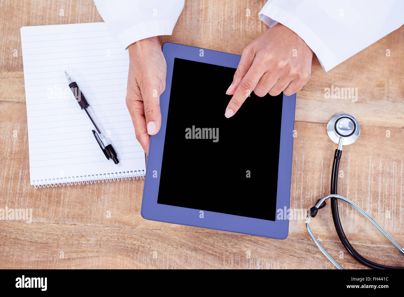Doctor using digital tablet Stock Photo - Alamy