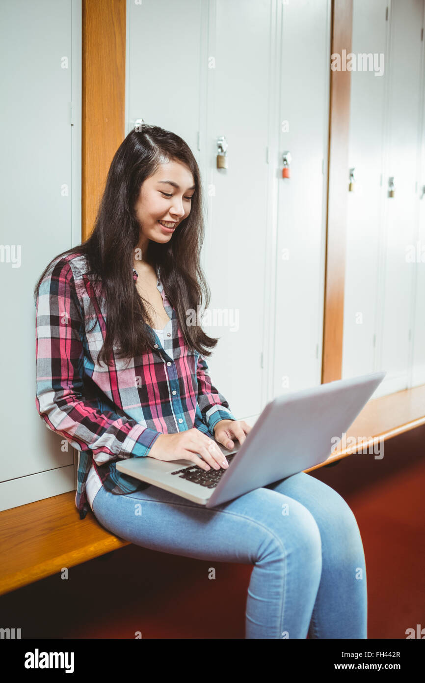Smiling student sitting at the computer Stock Photo - Alamy