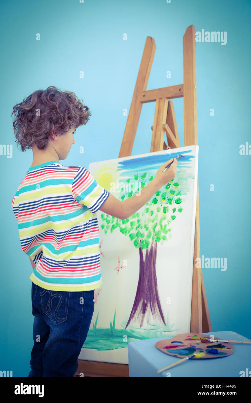 Happy boy painting his picture Stock Photo - Alamy