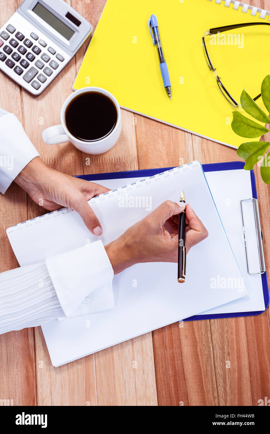 Part of hands taking notes Stock Photo - Alamy