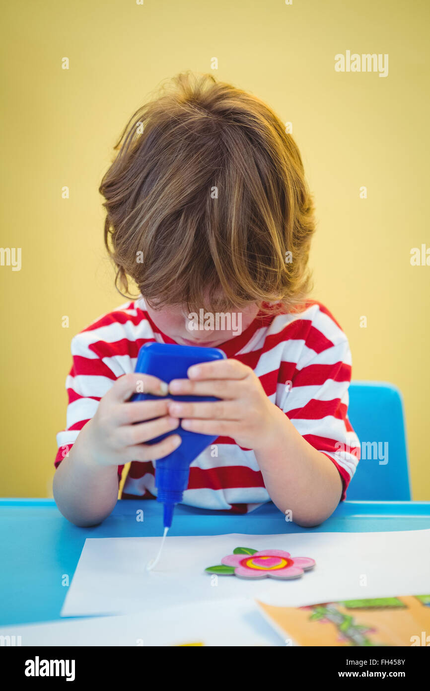 Child using glue hi-res stock photography and images - Alamy
