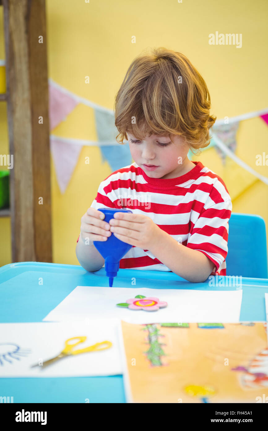 Child using glue hi-res stock photography and images - Alamy