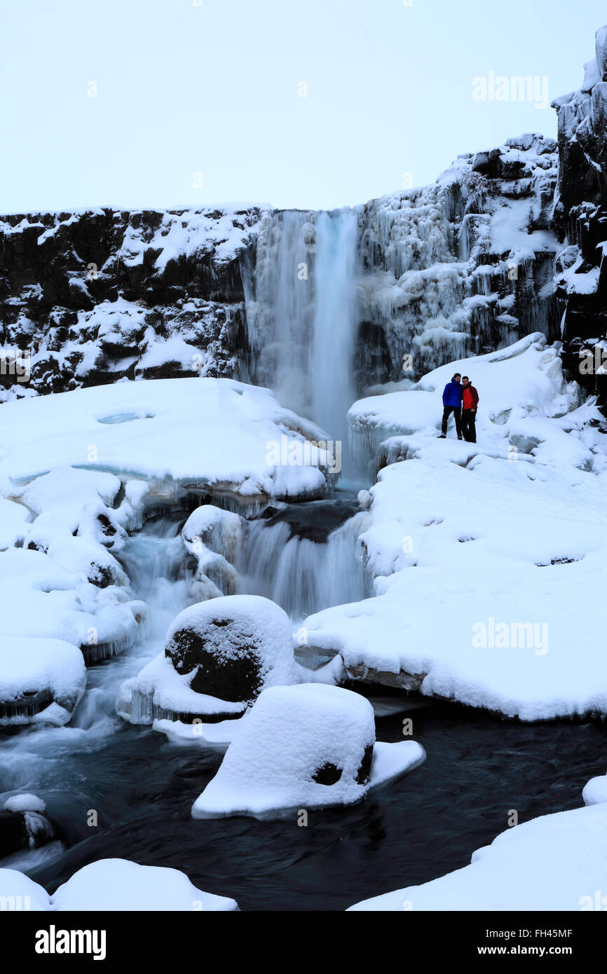 Winter snow over the Oxararfoss Waterfall, Pingvellir National Park ...