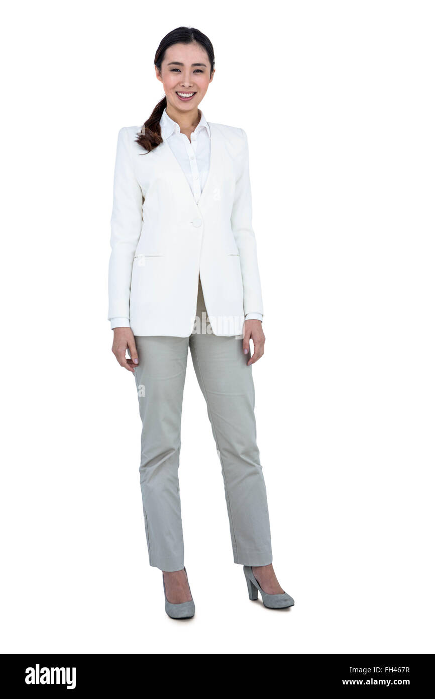 Smiling businesswoman standing straight up Stock Photo - Alamy