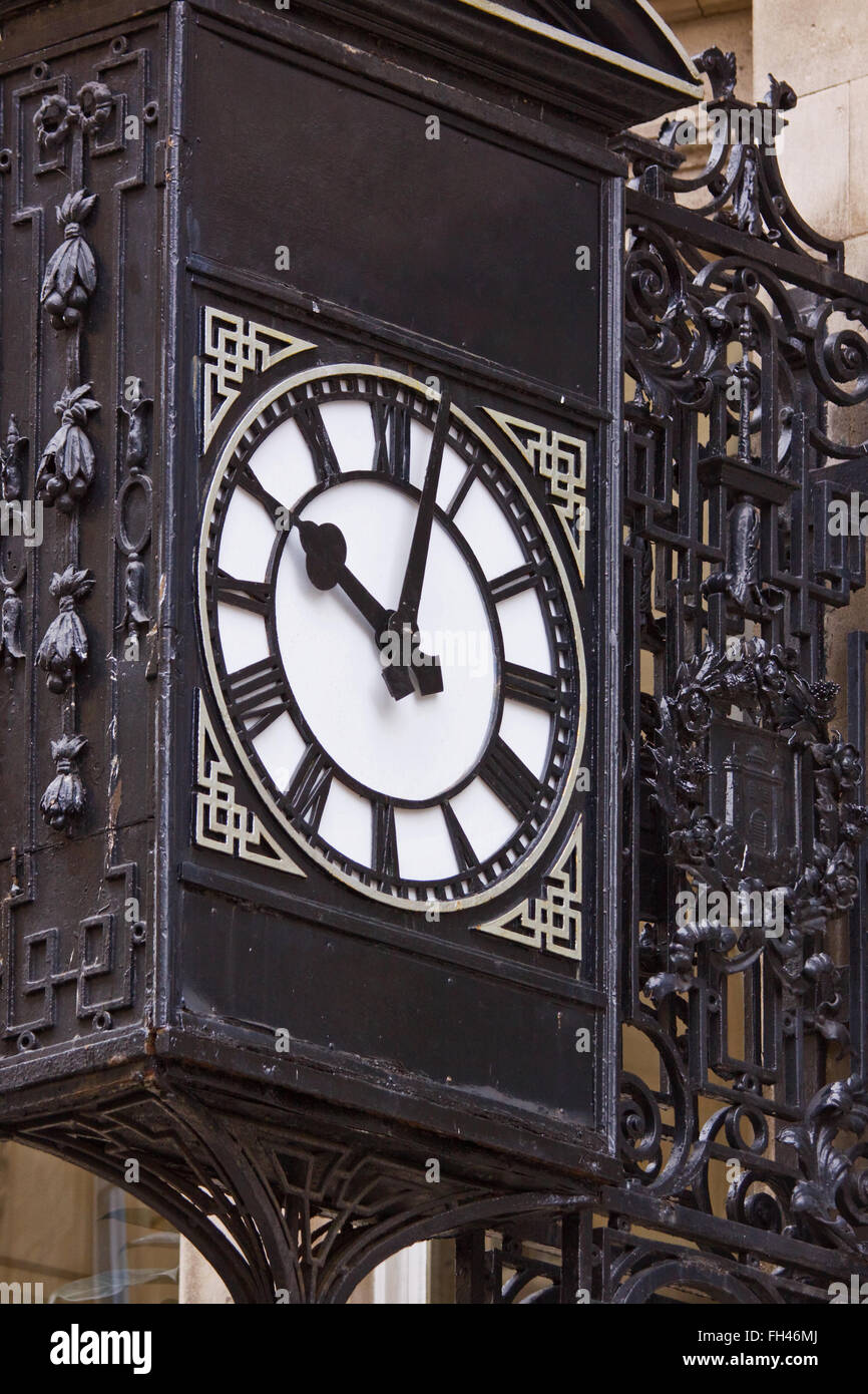 A retro style clock in an English high street Stock Photo - Alamy