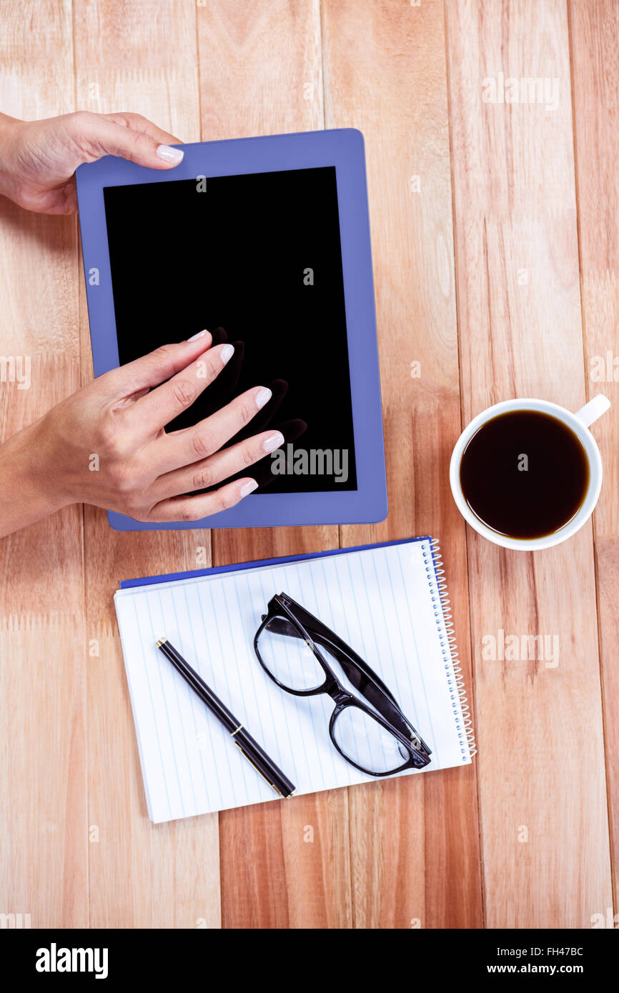 Overhead of feminine hands using tablet Stock Photo - Alamy