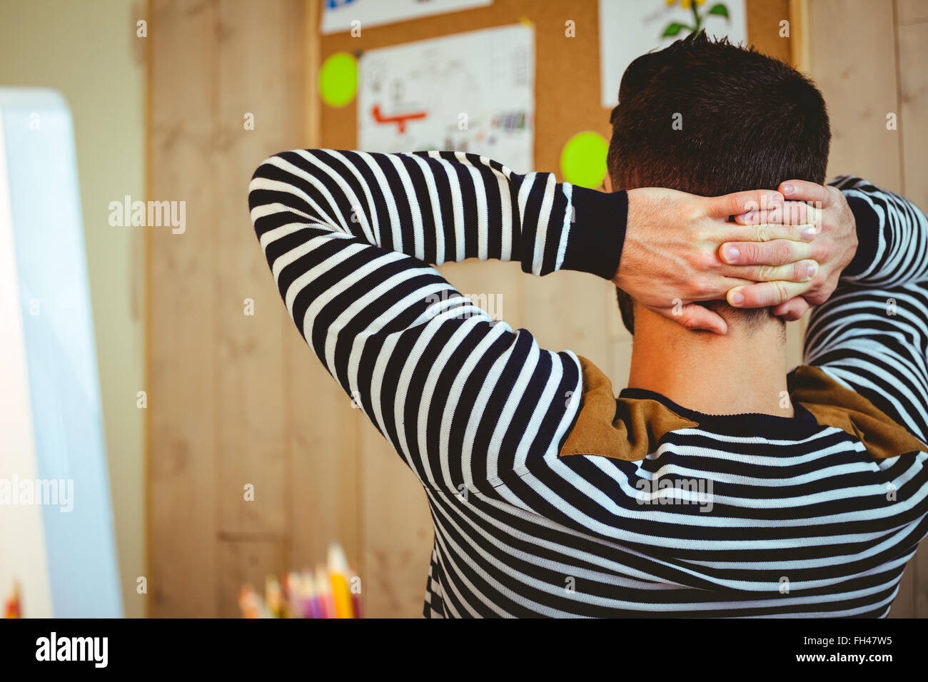 Man relaxing at his desk Stock Photo - Alamy