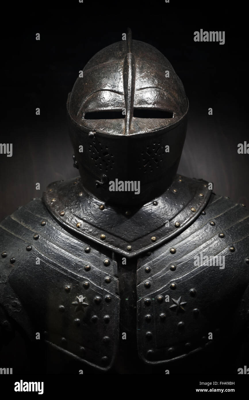 Ancient metal armor of the medieval knight. Dark vertical photo Stock ...