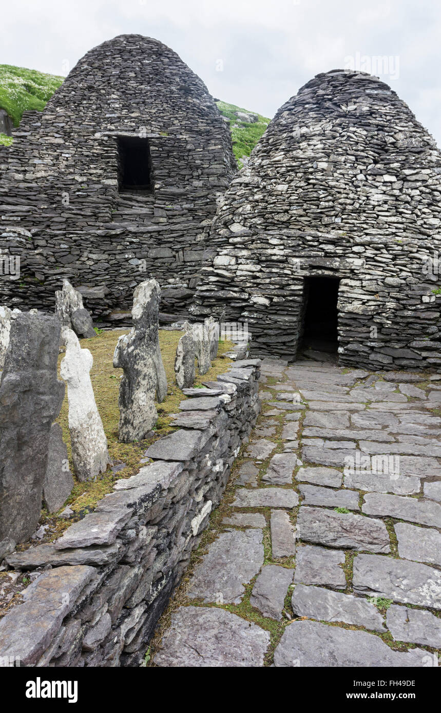 Stone, hand-carved crosses in graveyard of monastery, Skellig Michael ...