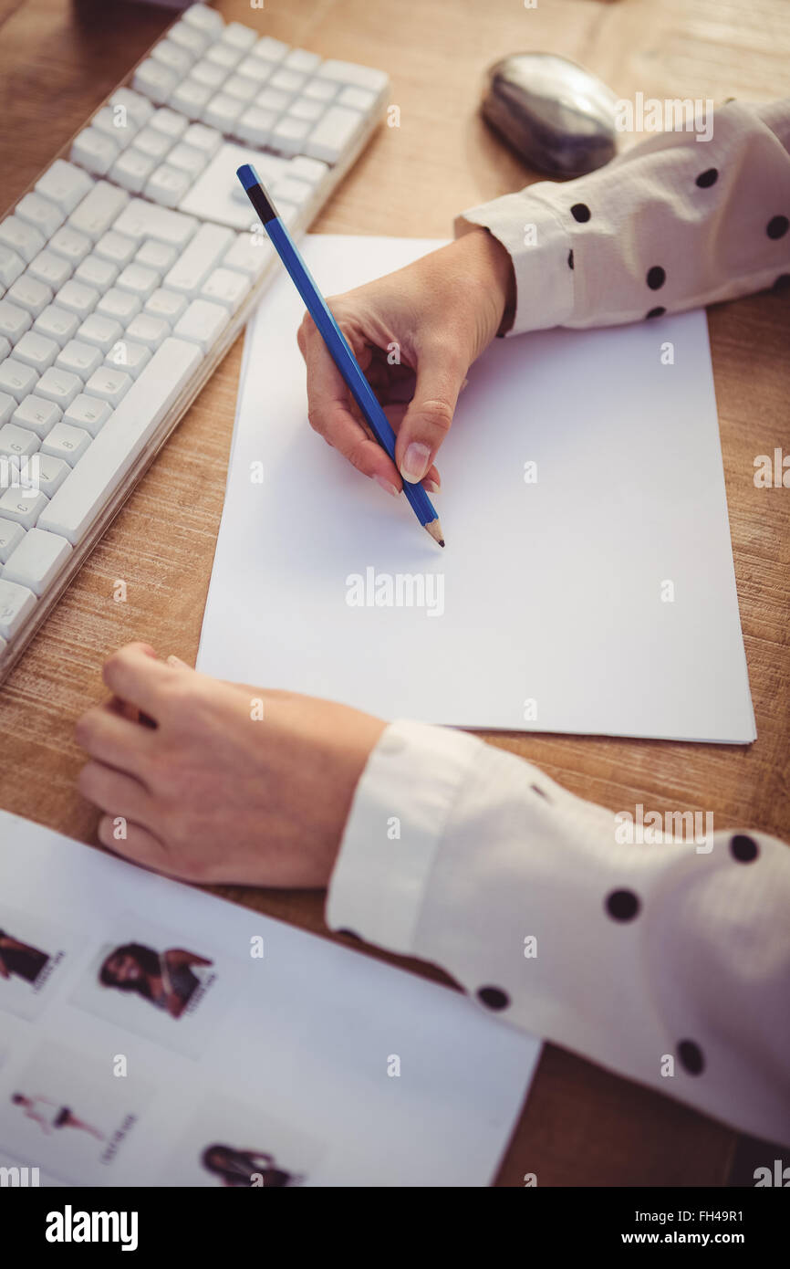 Cropped image of woman drawing Stock Photo - Alamy